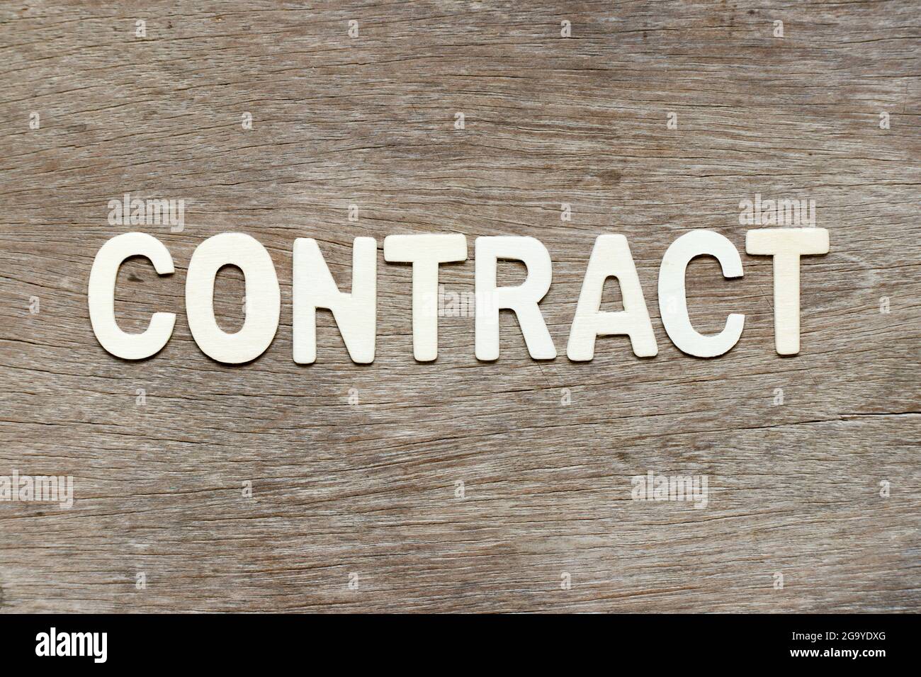 Alphabet letter in word contract on wood background Stock Photo - Alamy