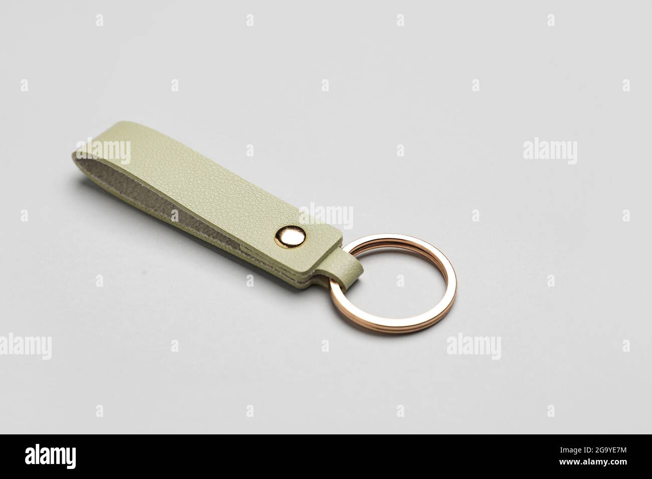 Leather keychain on grey background Stock Photo - Alamy