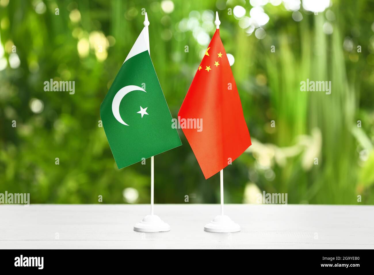 Flags of China and Pakistan on table outdoors Stock Photo - Alamy