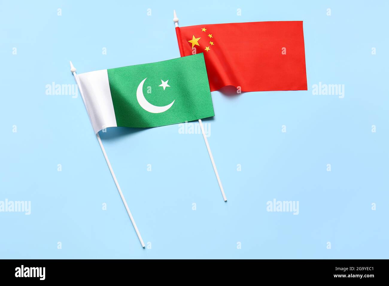Flags of China and Pakistan on color background Stock Photo - Alamy