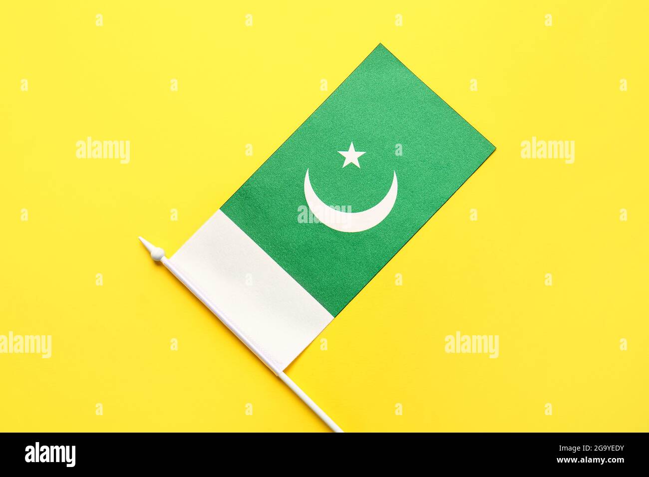 Pakistan flag on color background Stock Photo - Alamy