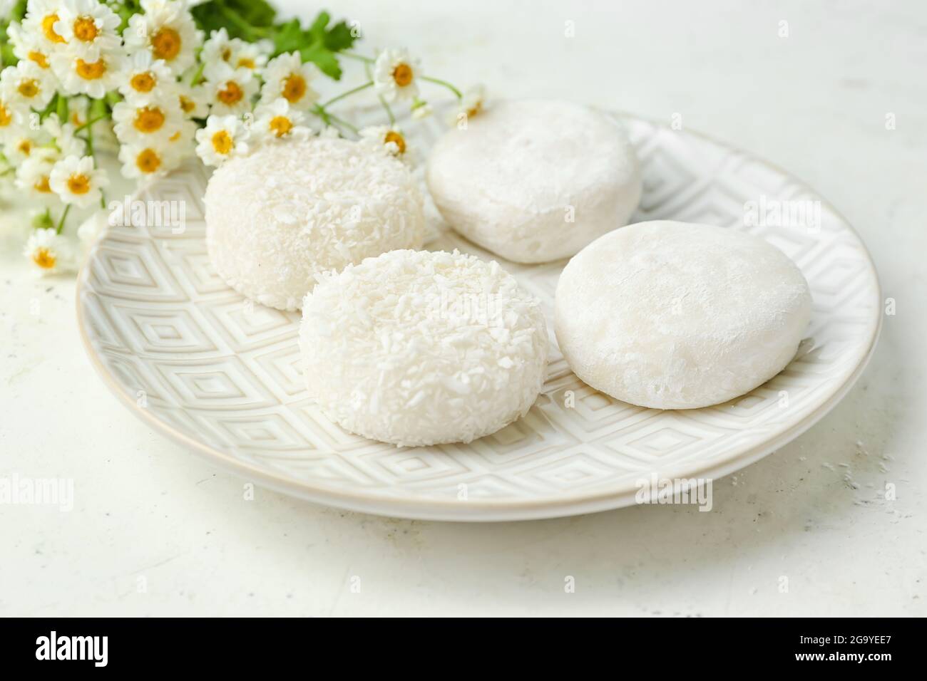 Plate with tasty Japanese mochi on light background Stock Photo - Alamy