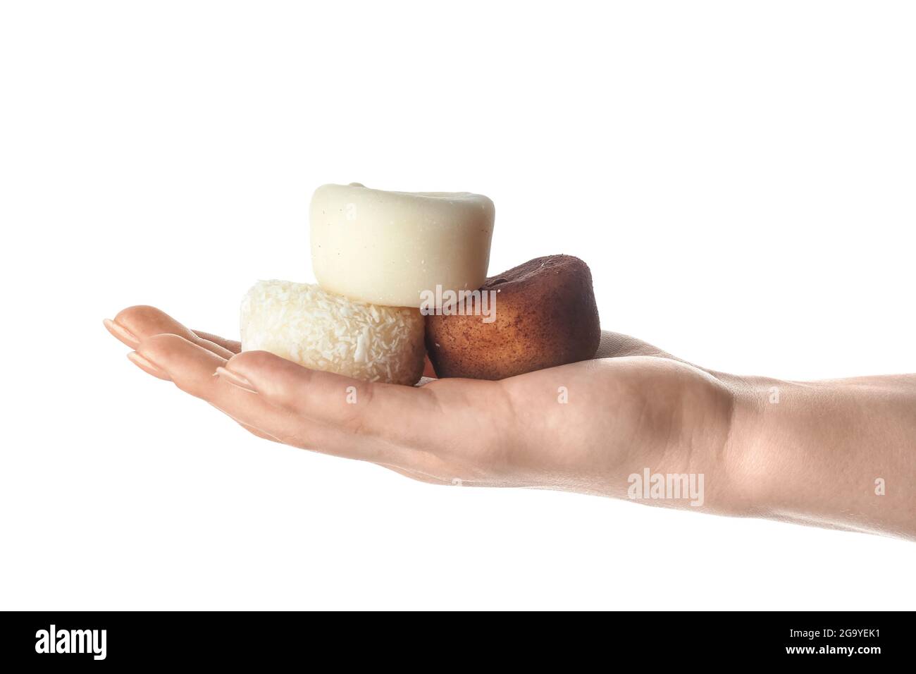Female hand with tasty Japanese mochi on white background Stock Photo ...