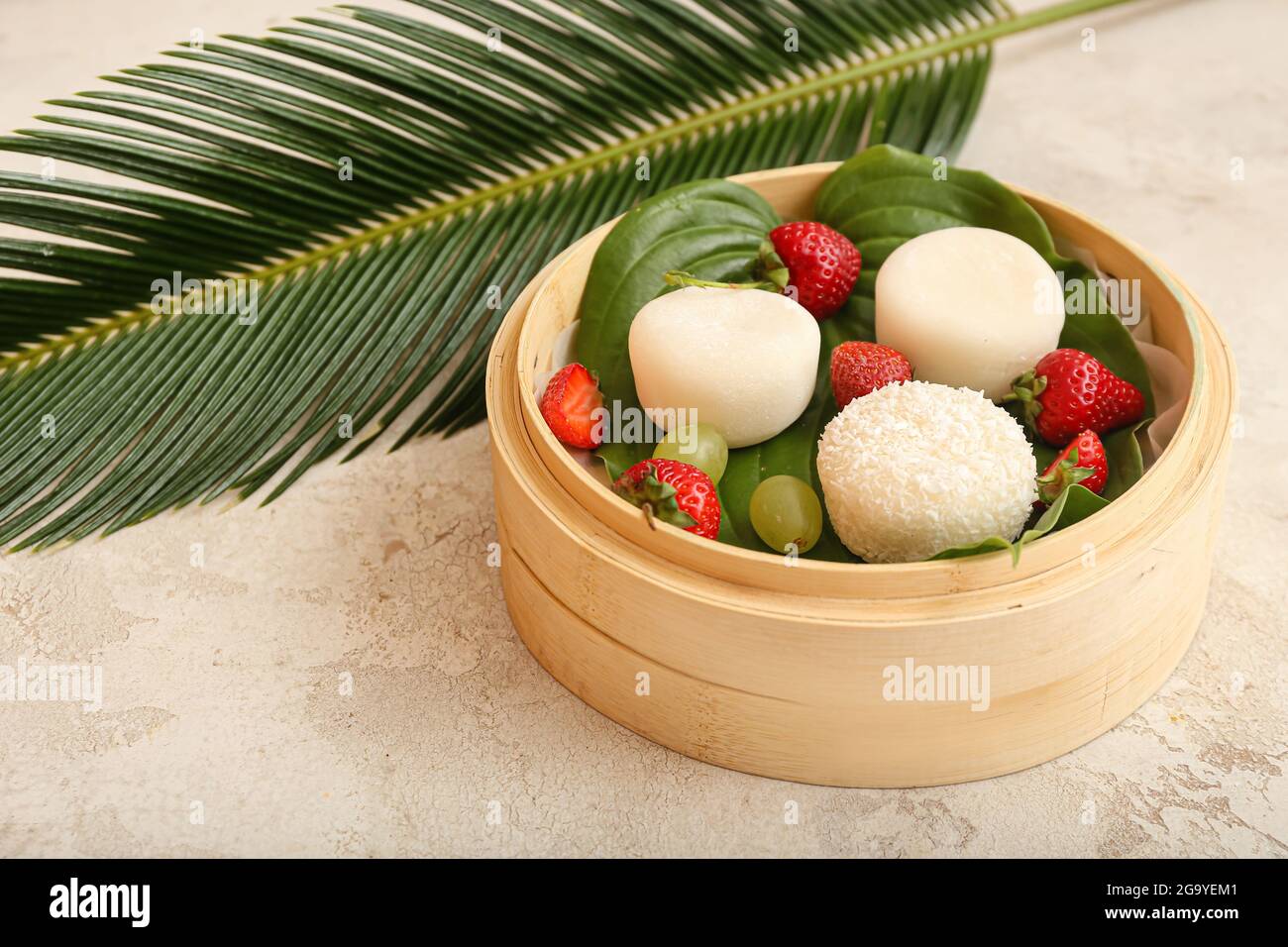 Box with tasty Japanese mochi on grunge background Stock Photo - Alamy
