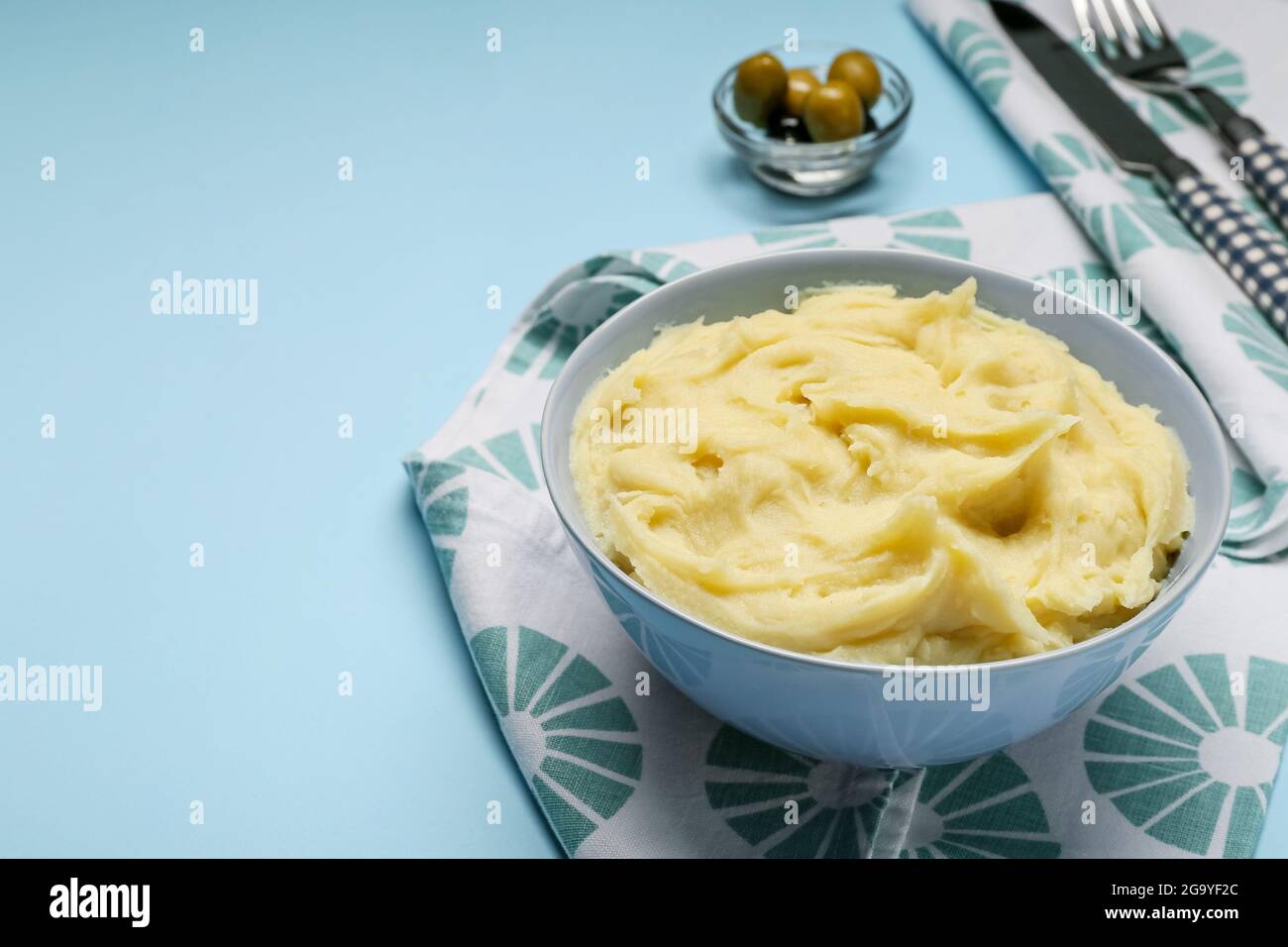 Composition with tasty mashed potatoes on color background Stock Photo ...