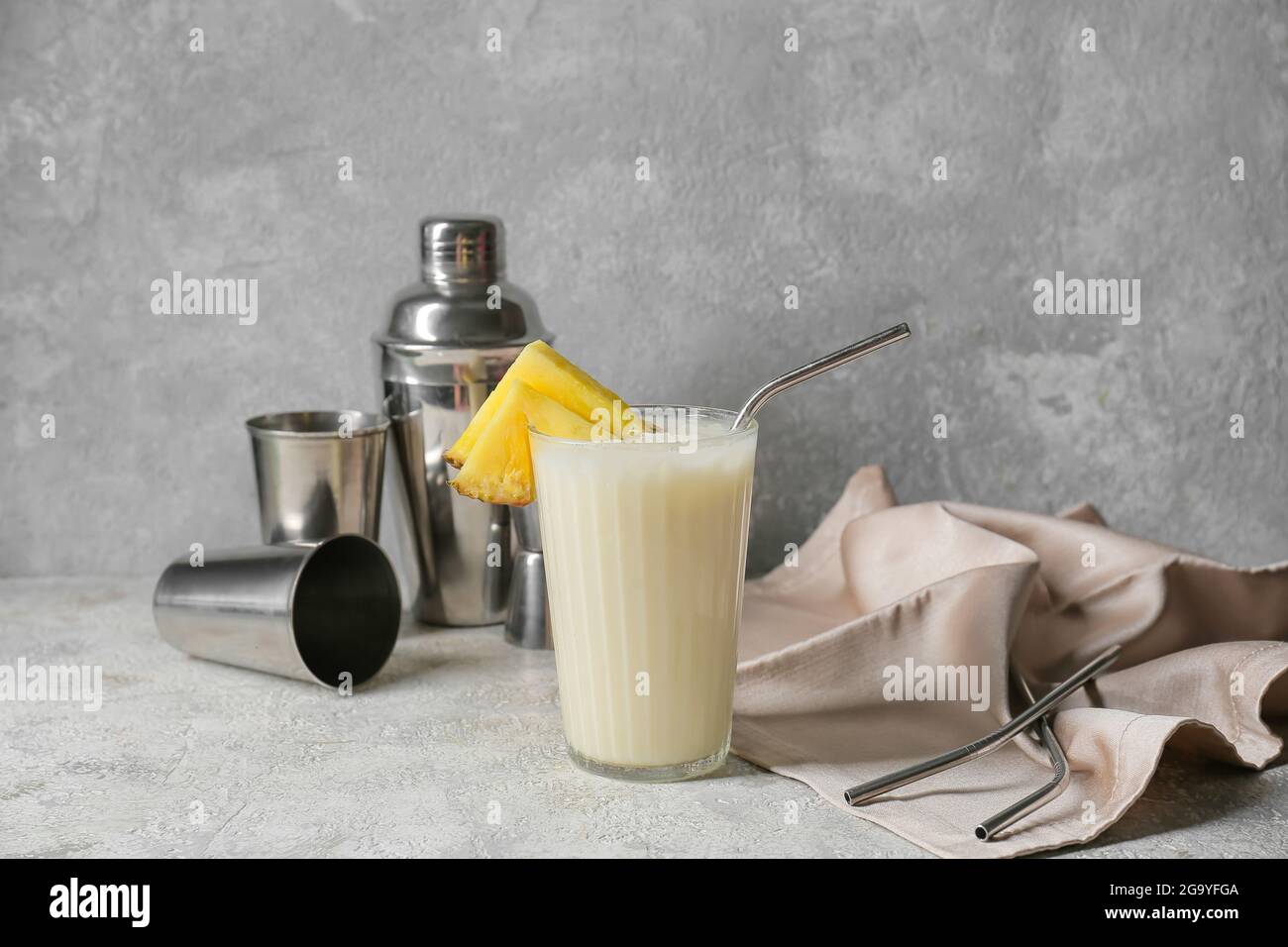 Glass with tasty Pina Colada cocktail on light background Stock Photo ...