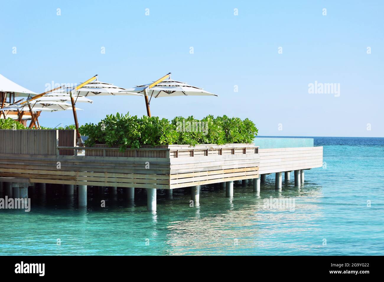 Restaurant in ocean on blue sky background Stock Photo - Alamy
