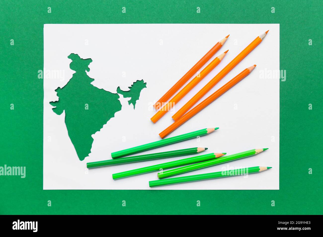 Paper sheet with Indian continent and pencils on color background Stock ...