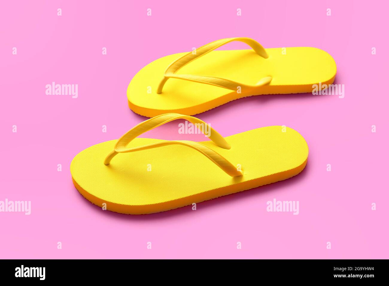 Stylish flip-flops on color background Stock Photo - Alamy