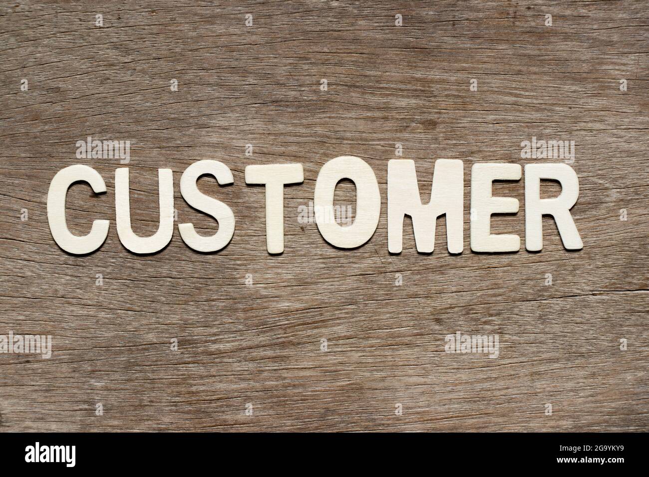 Alphabet letter in word customer on wood background Stock Photo - Alamy