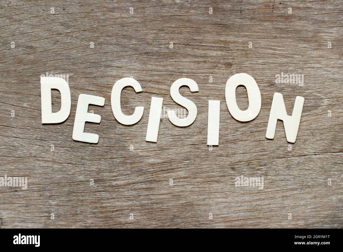 Alphabet letter in word decision on wood background Stock Photo - Alamy