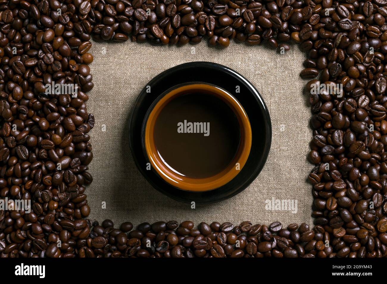 Coffee beans and Coffee cup on a burlap background Stock Photo - Alamy