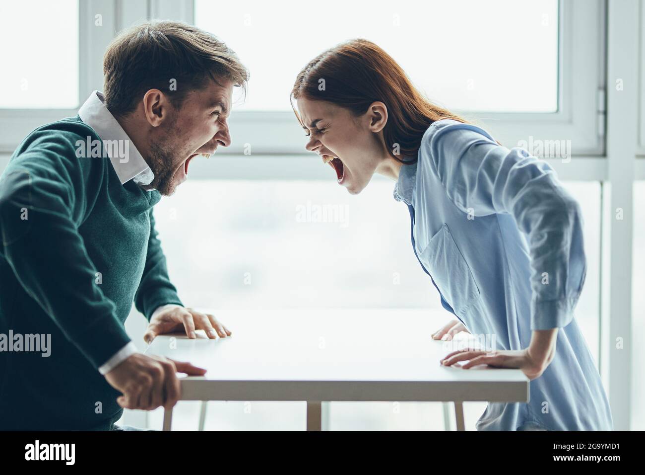 emotional man and woman screaming at each other conflict Stock Photo ...