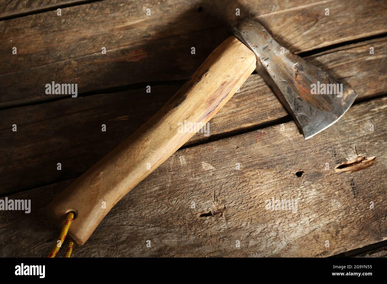 Sharp axe on wooden background Stock Photo - Alamy