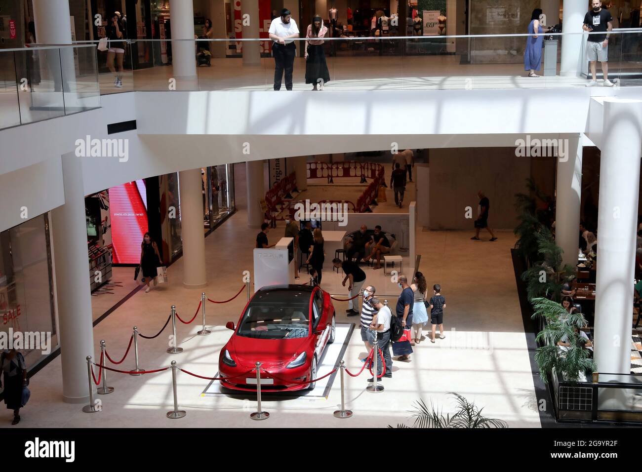 Tel Aviv, Israel. 27th July, 2021. People view a Tesla Model 3 electric ...