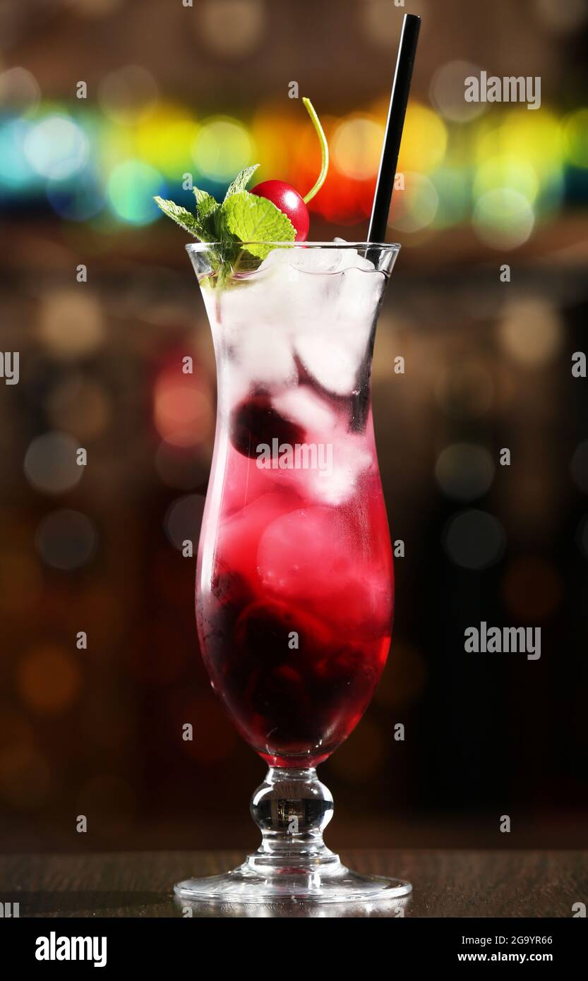 Glass of cocktail on bar background Stock Photo - Alamy