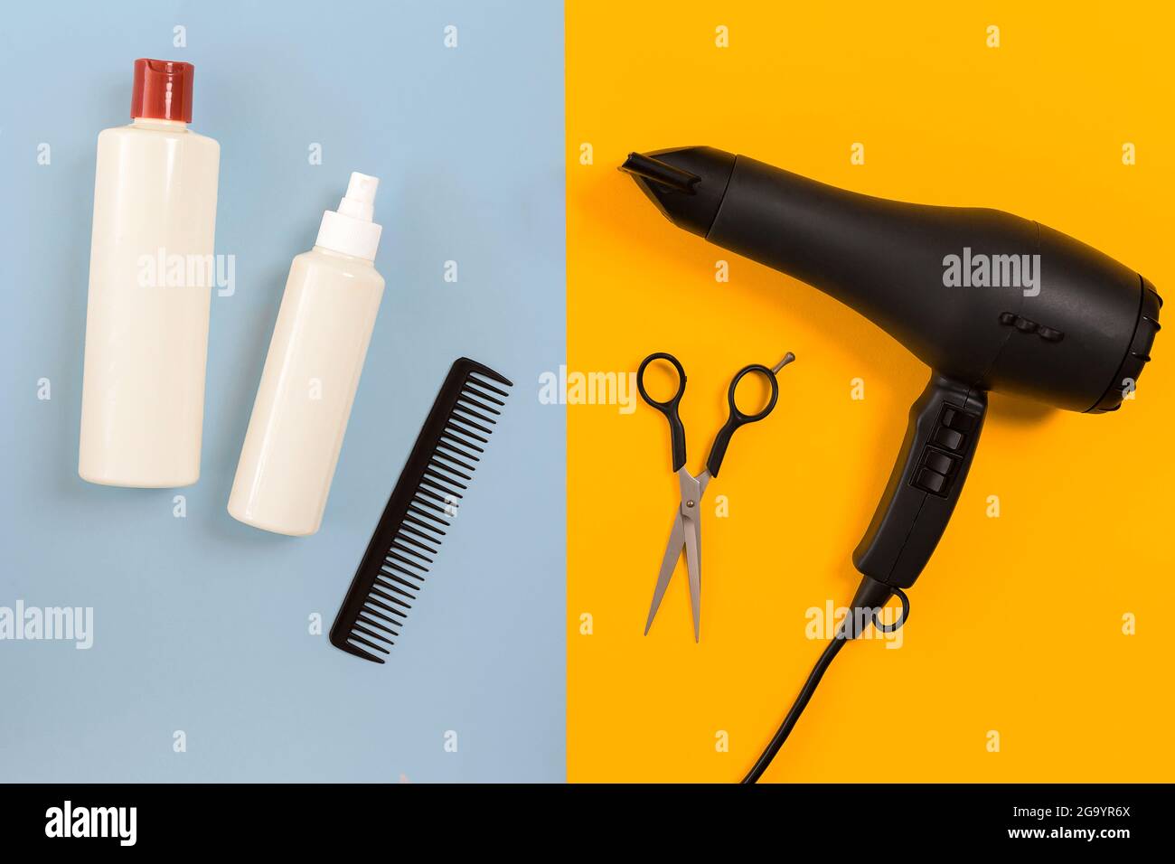 Various hair styling devices on the color blue, yellow paper background ...