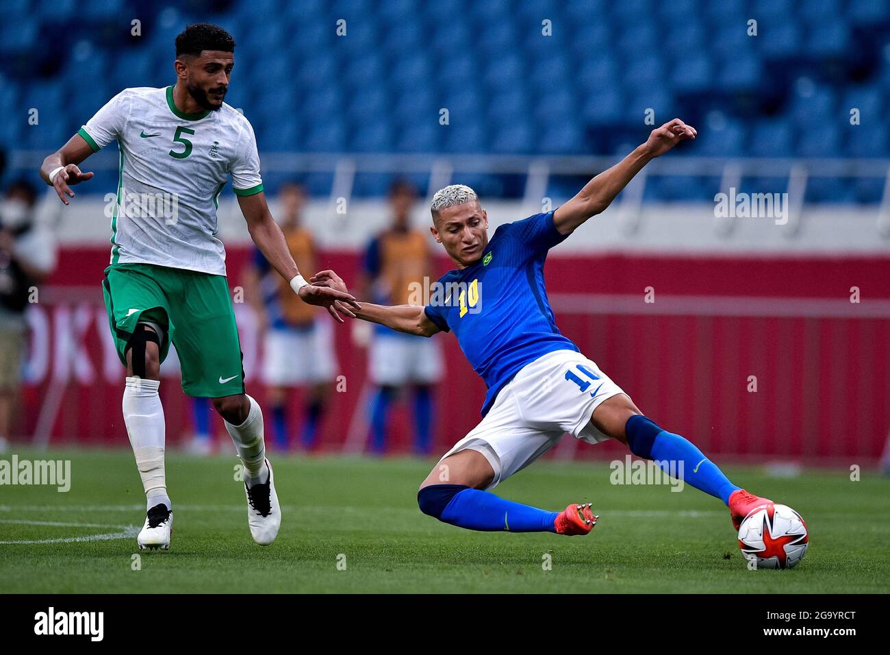 SAITAMA, JAPAN - JULY 28: Abdulelah Al Amri of Saudi Arabia and ...