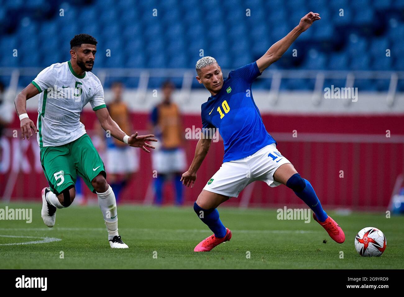 SAITAMA, JAPAN - JULY 28: Abdulelah Al Amri of Saudi Arabia and ...