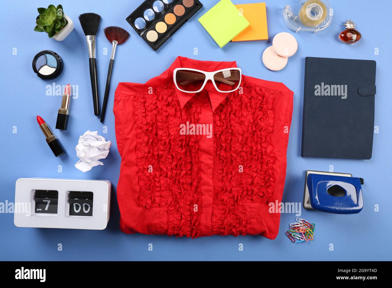 Modern female clothing and accessories on color background Stock Photo ...