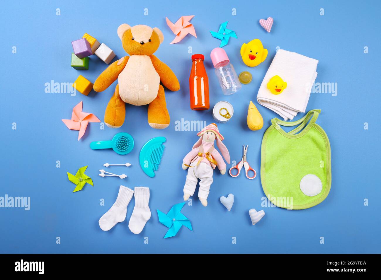 Baby collection on blue background, top view Stock Photo - Alamy