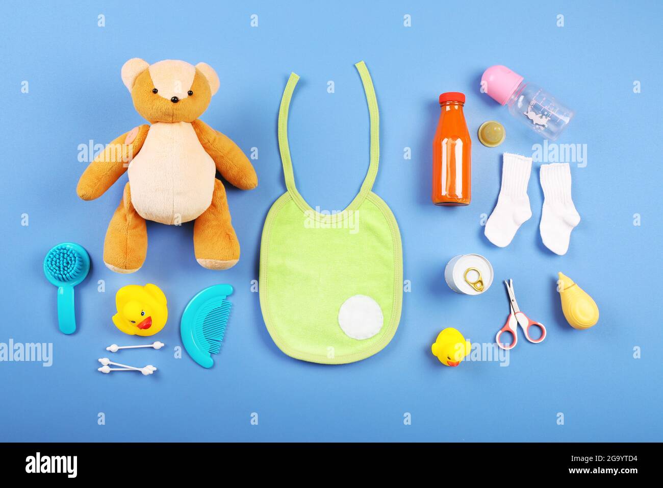 Baby collection on blue background, top view Stock Photo - Alamy
