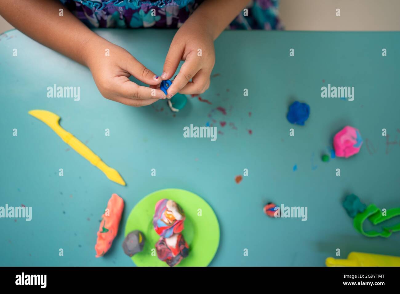 Child playing with colorful plaster Stock Photo - Alamy