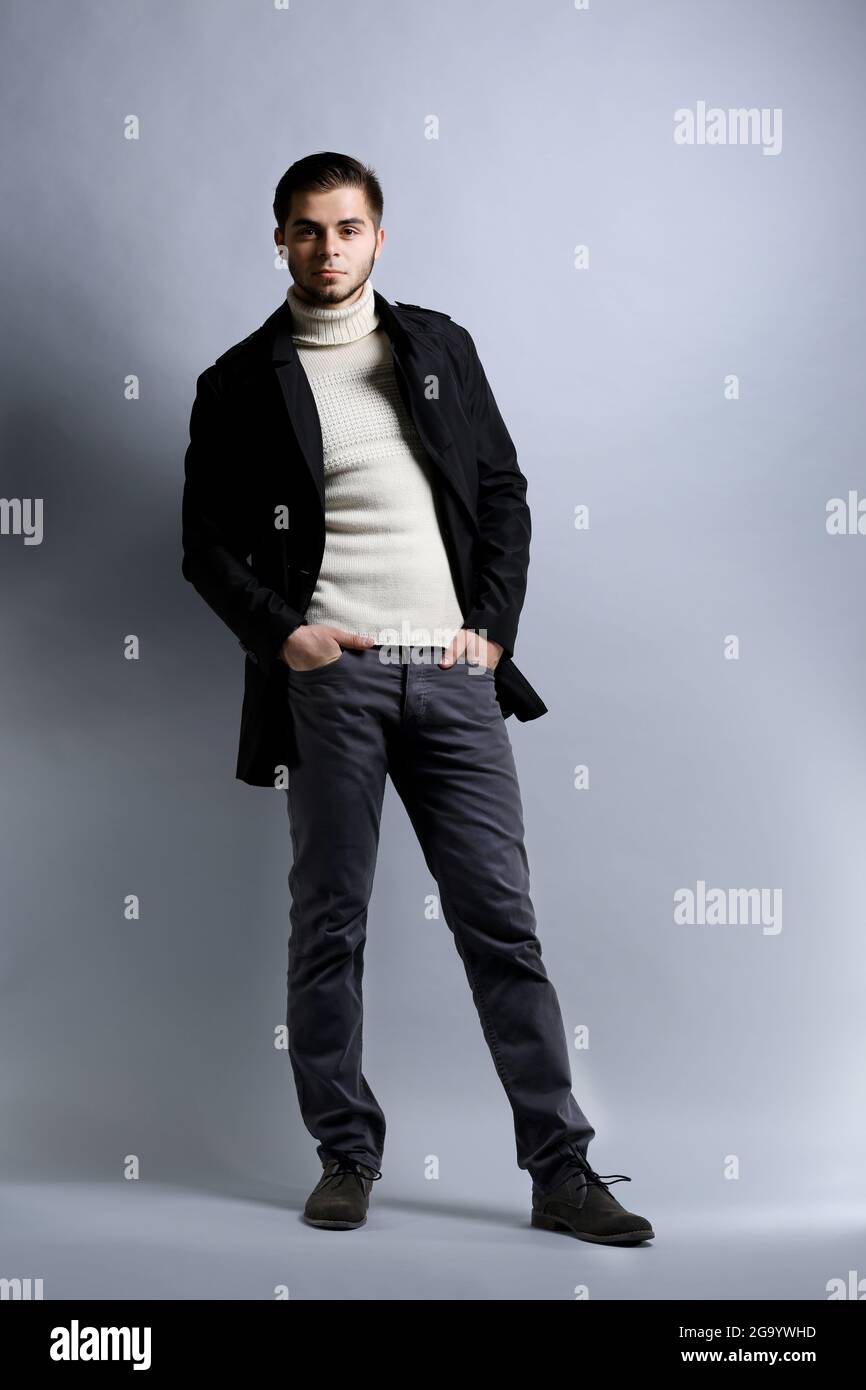 Elegant man on gray background Stock Photo - Alamy