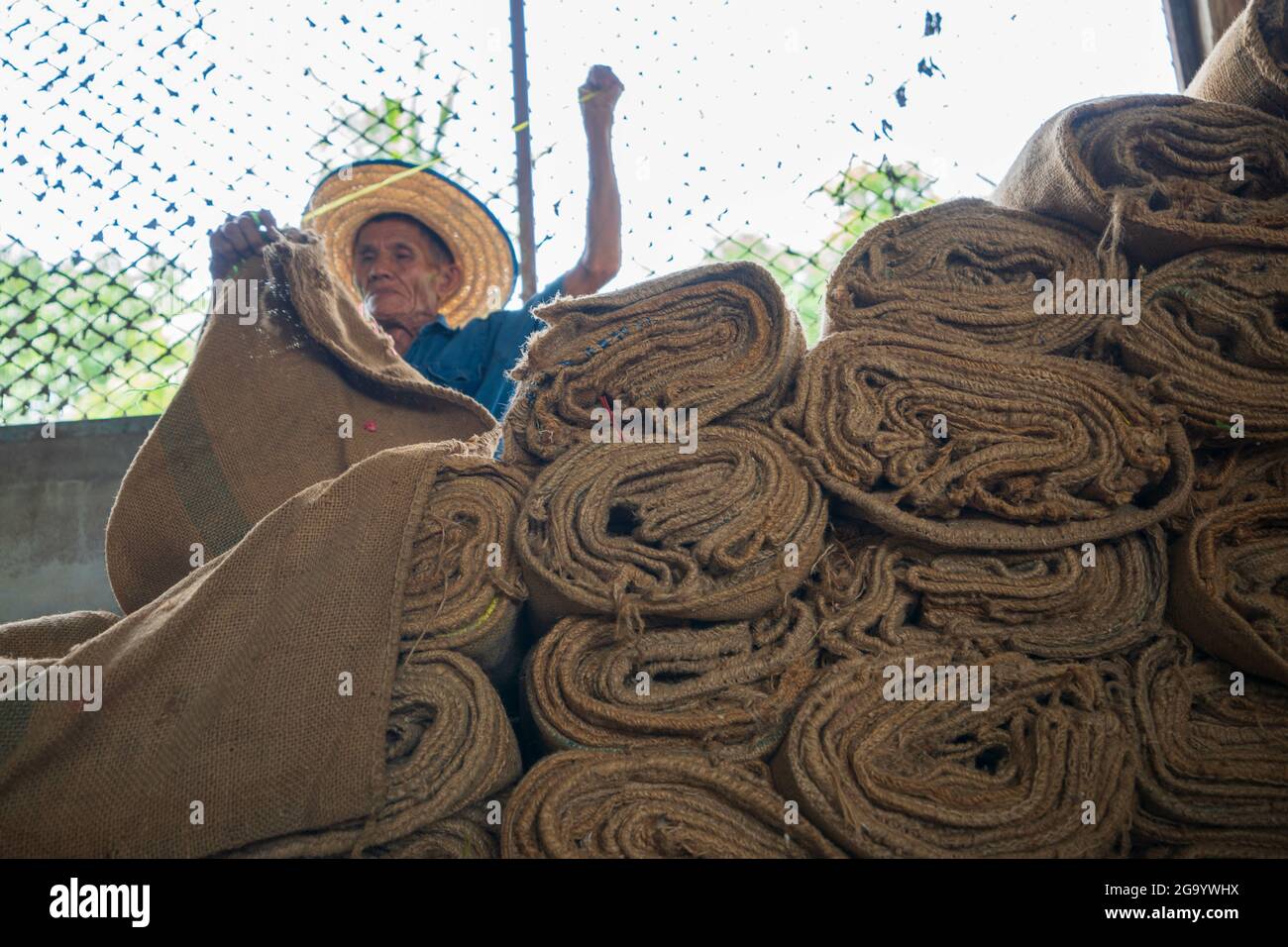 Man sewing bags hi-res stock photography and images - Alamy
