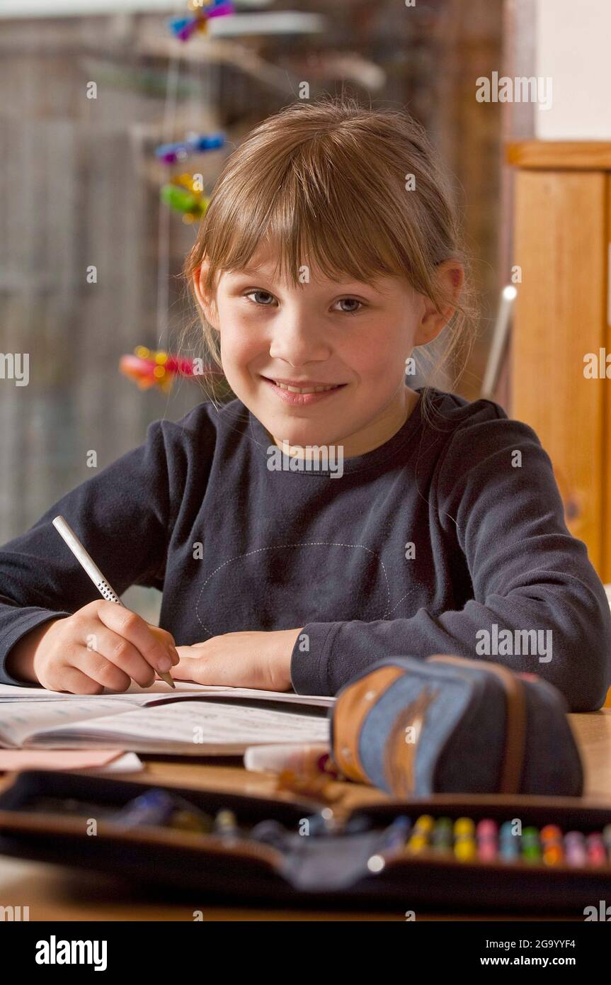 smart girl doing homework, school is fun , Germany Stock Photo - Alamy