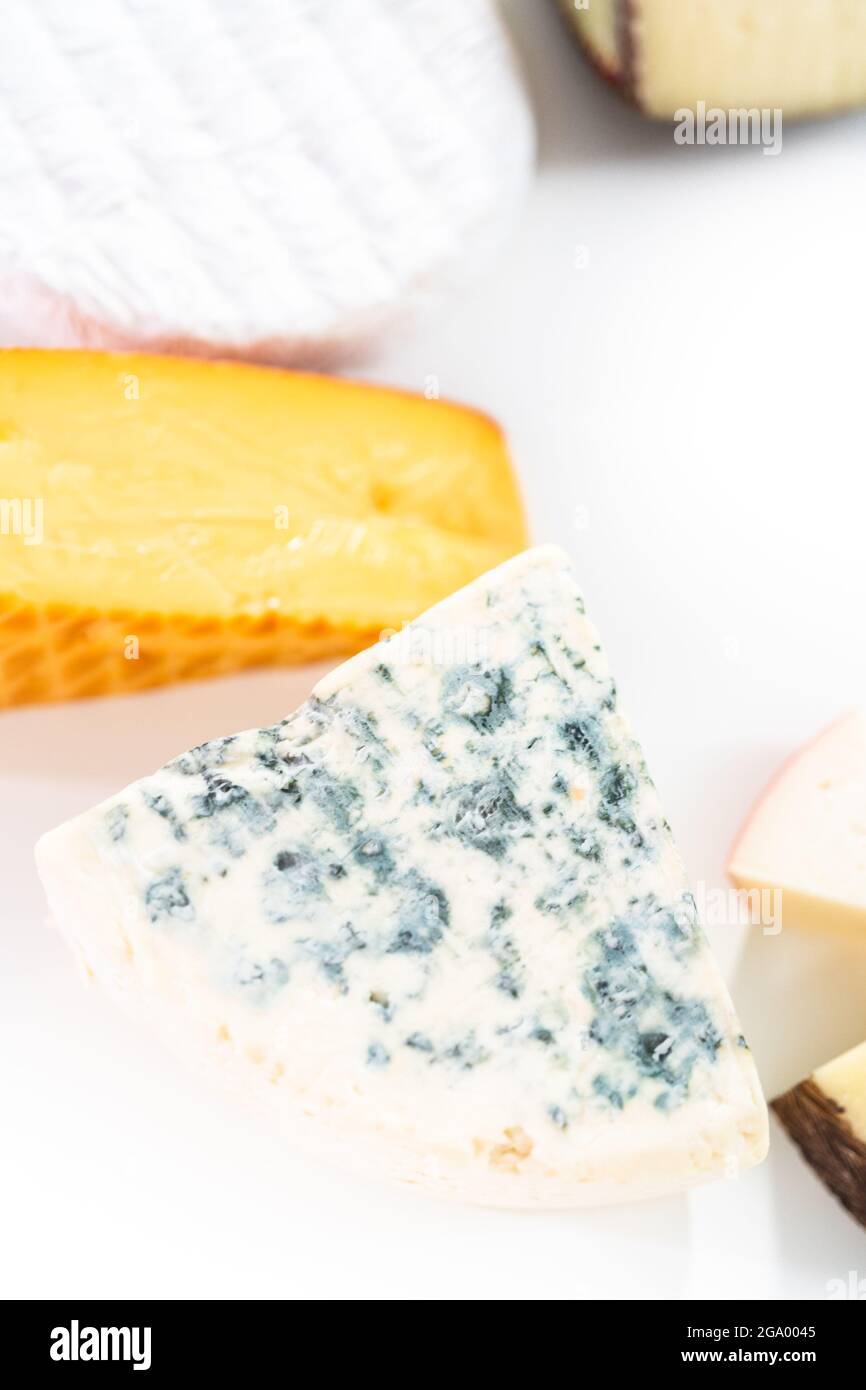 Variety of large wedges gourmet cheese on a white background Stock ...