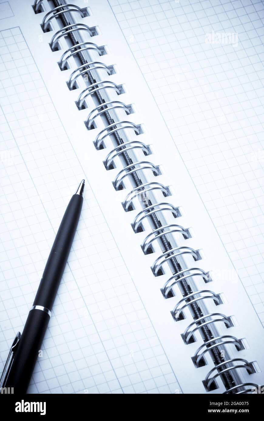 black ballpoint pen on a spiral notebook Stock Photo - Alamy
