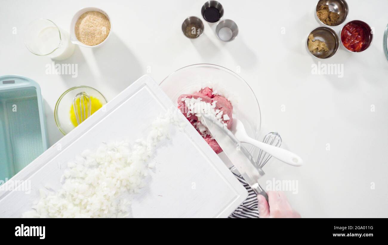 Flat lay. Step by step. Mixing ingredients for a classic beef meatloaf ...