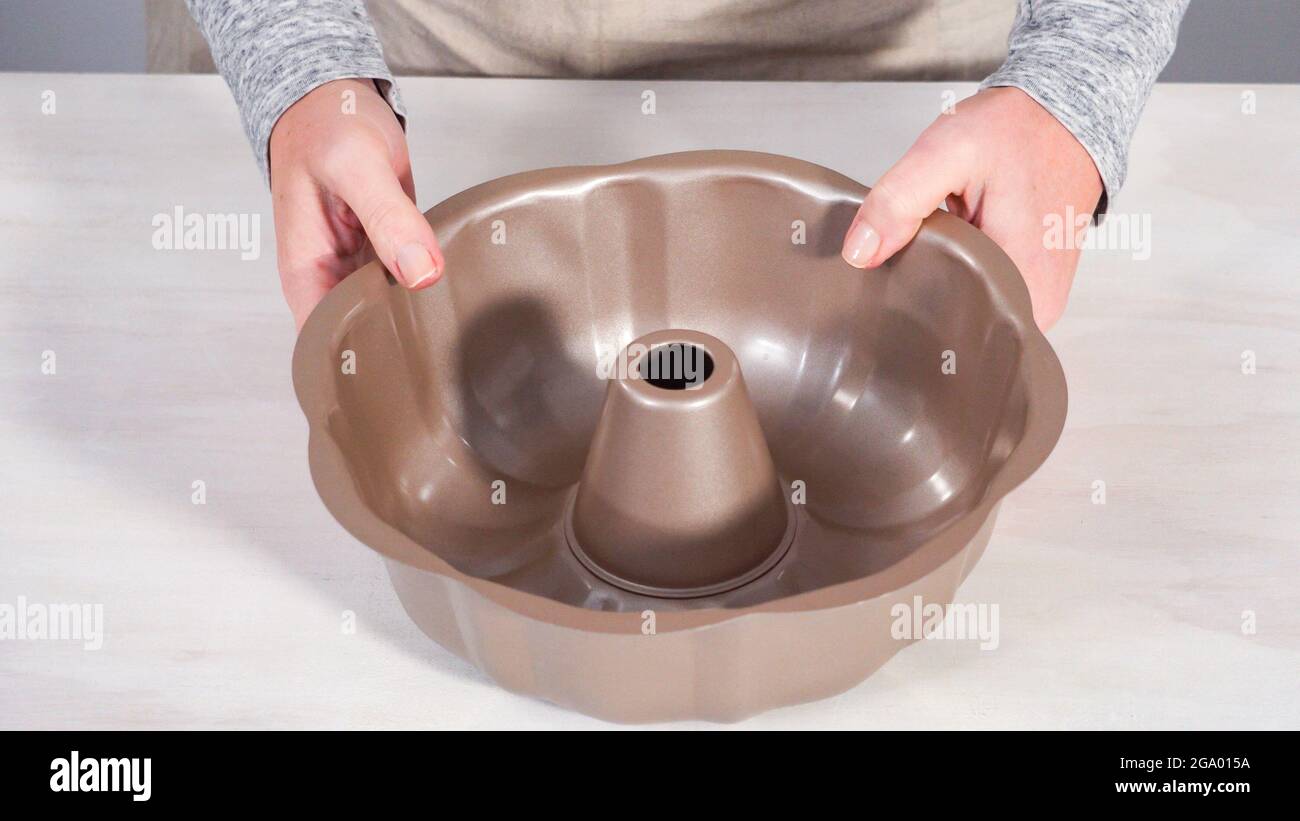Step by step. Greased metal bundt cake pan to bake chocolate bundt cake ...