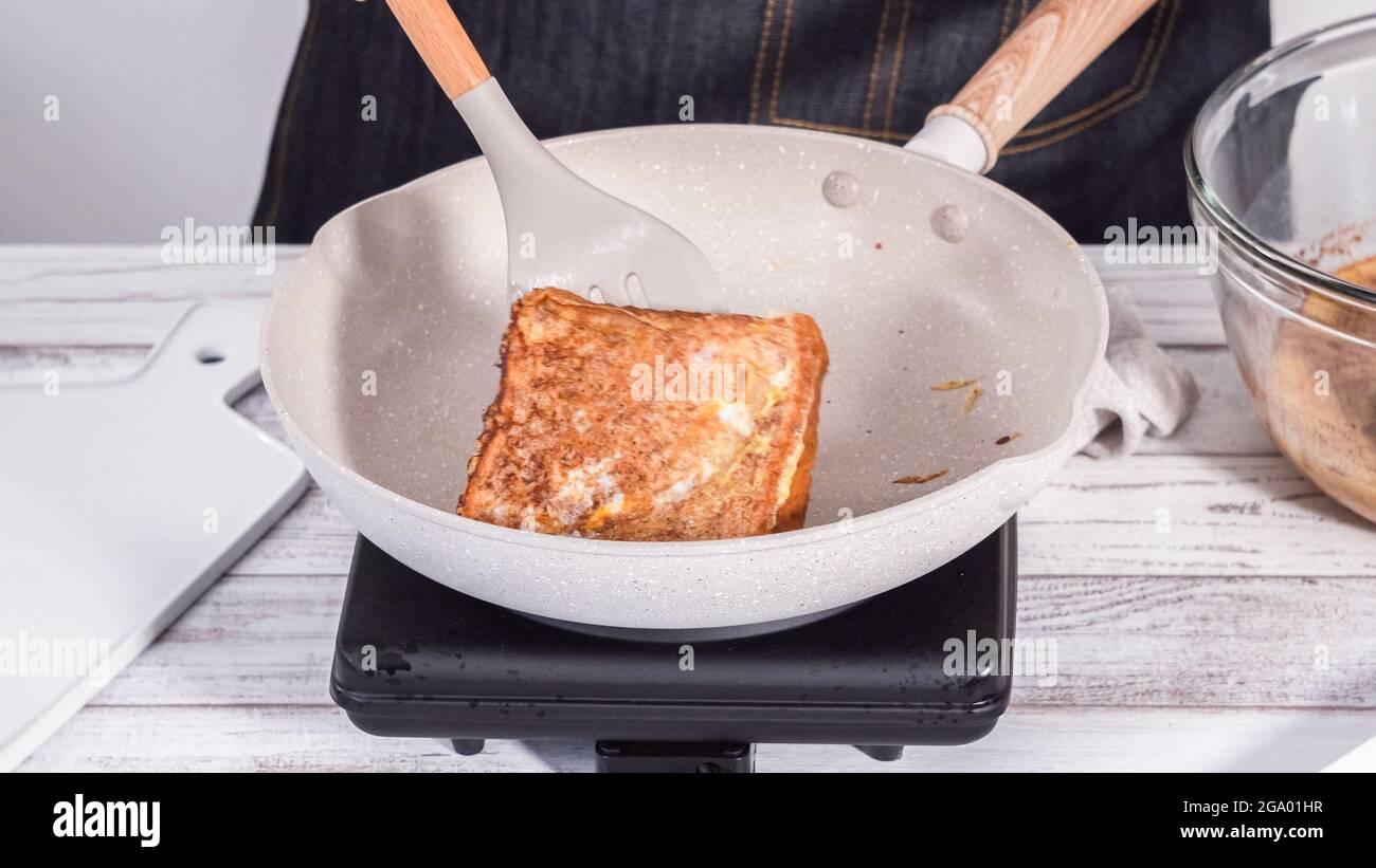 Step by step. Frying french toast in a nonstick frying pan Stock Photo ...