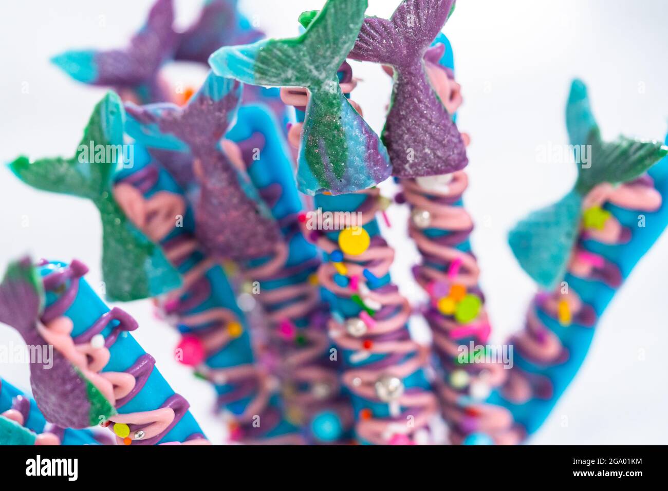 Mermaid chocolate pretzel rods drizzled with pink and purple chocolate ...