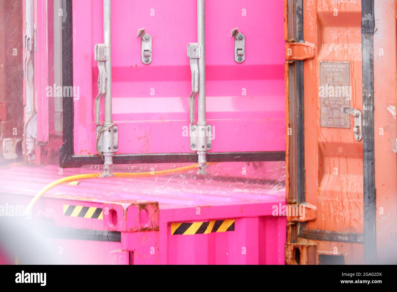 container cleaning Outdoors with a high-pressure cleaner Stock Photo ...