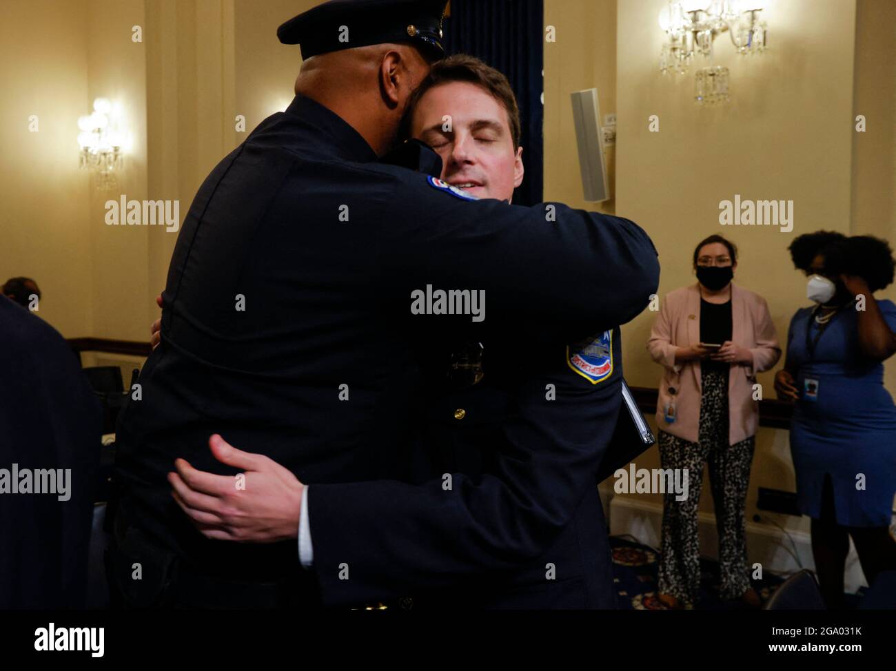 U.S. Capitol Police Officer Harry Dunn embraces Metropolitan Police Officer Daniel Hodges ...