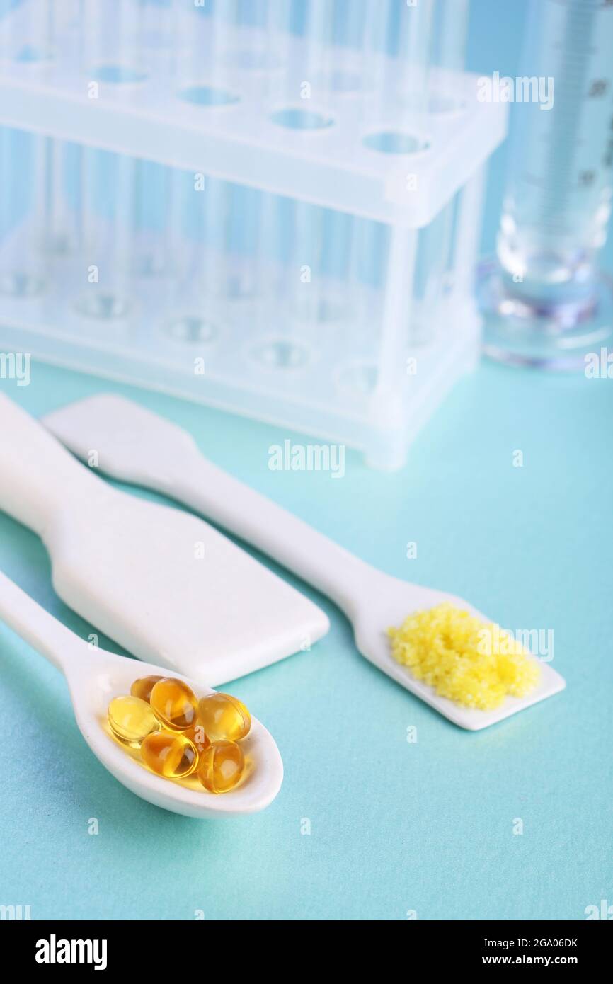 Laboratory spatulas on blue table Stock Photo - Alamy