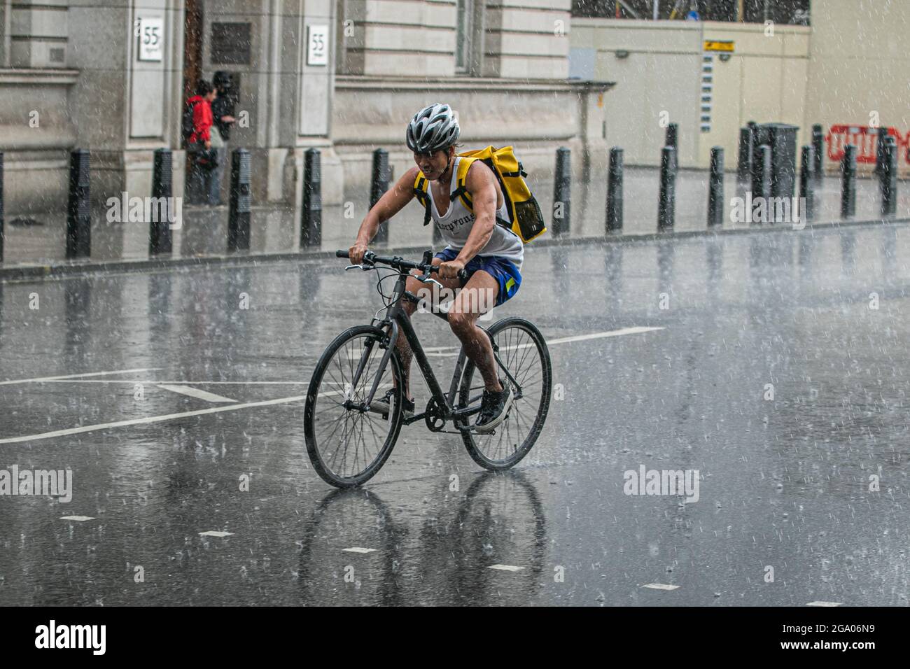 Torrential rain cyclist hi-res stock photography and images - Alamy