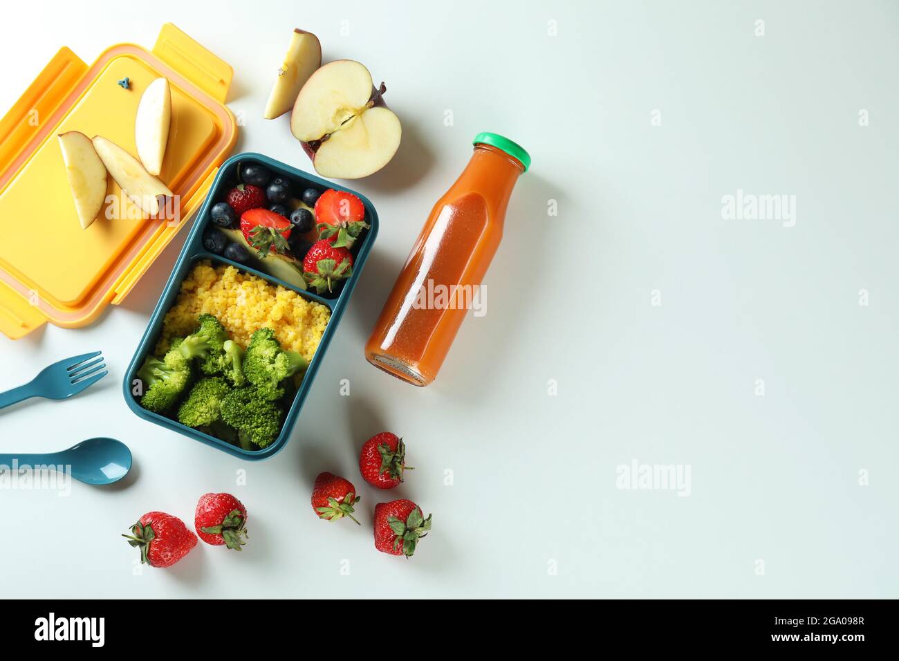 Lunch box with tasty food on white background Stock Photo - Alamy