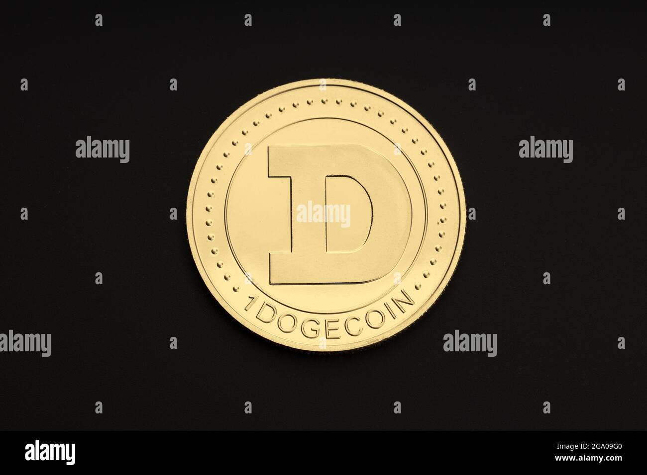 Dogecoin coin isolated on black background Stock Photo - Alamy
