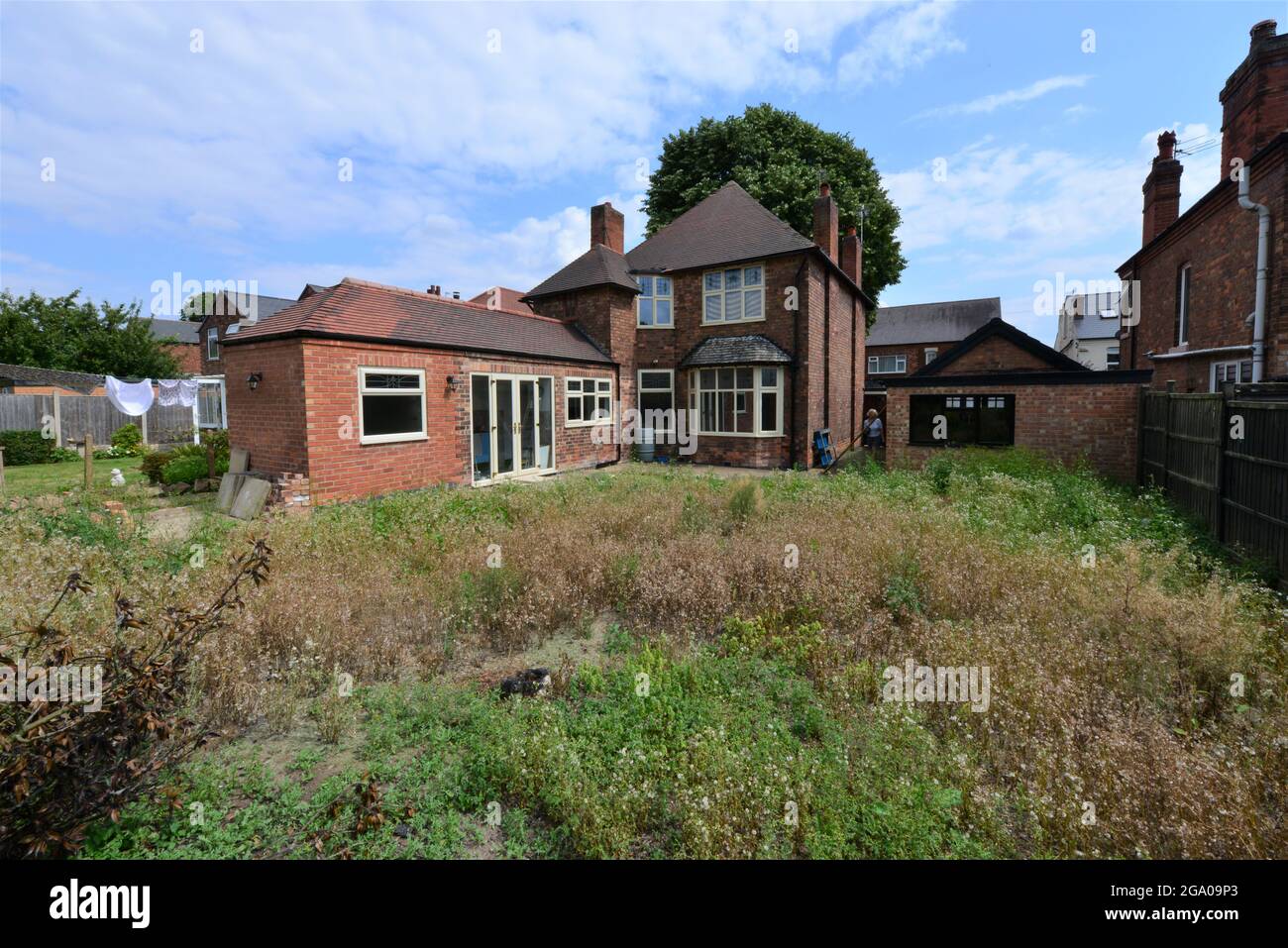 A neglected garden at an empty house in the uk Stock Photo - Alamy