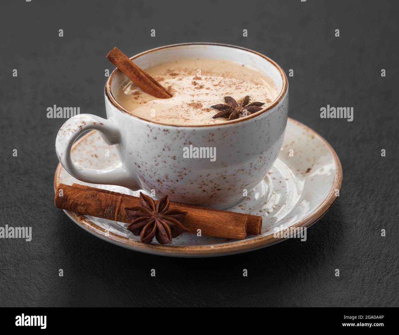 Masala chai tea closeup. Traditional Indian drink with spices and milk ...