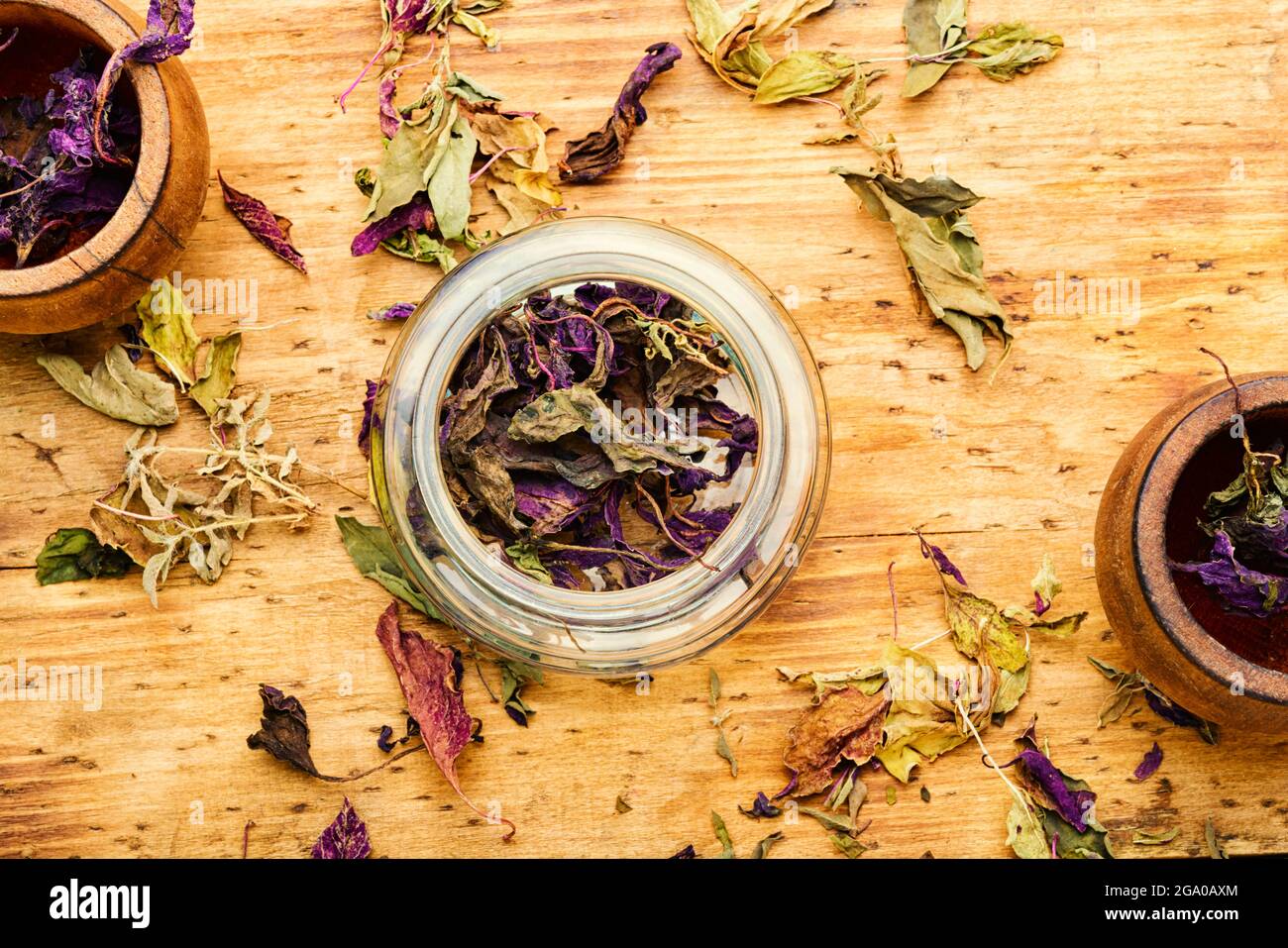 Dried natural basil spice on old rustic wooden background.Dry basil ...