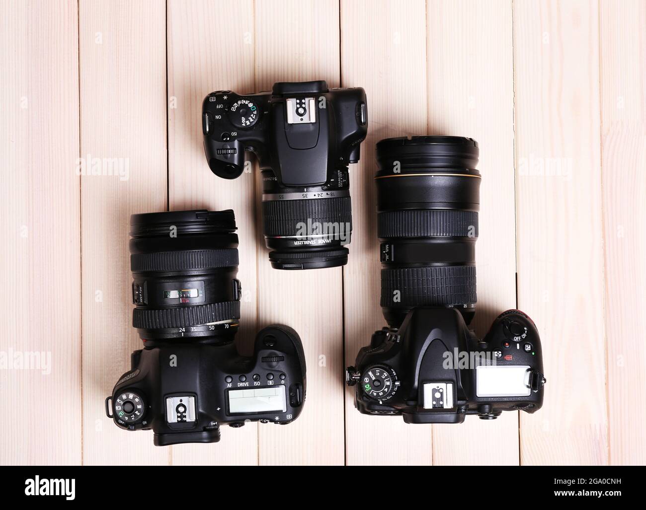 Modern cameras on wooden table, top view Stock Photo - Alamy