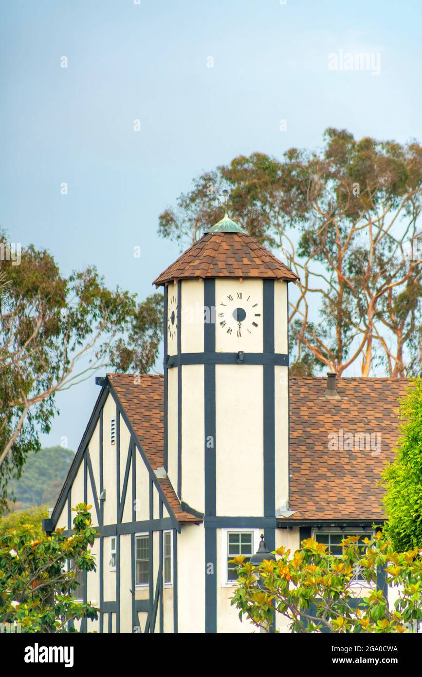 Building with a clock tower and shingles roof Stock Photo - Alamy