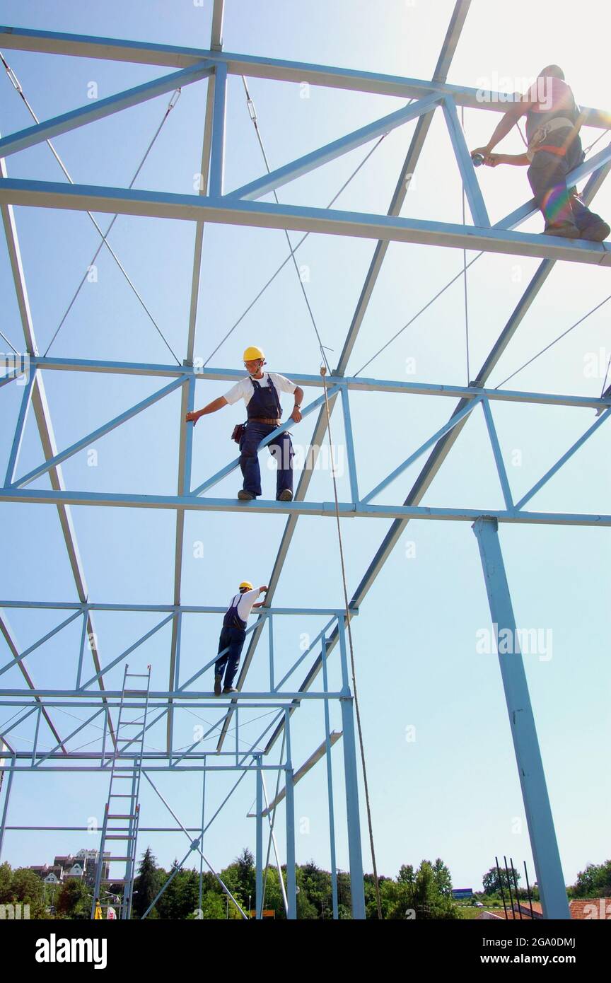 Iron Workers working on Iron Construction frame of tall apartment ...