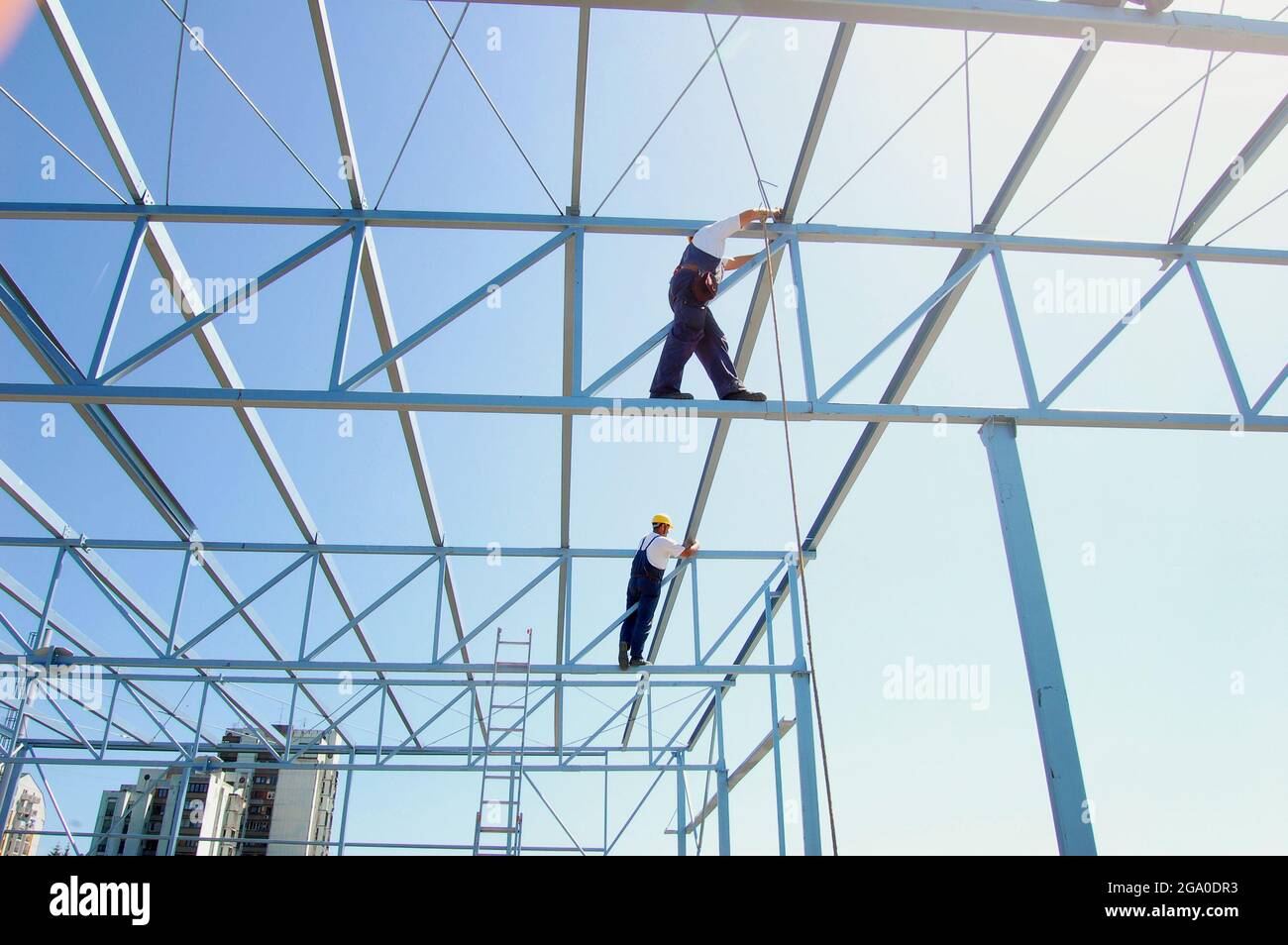 Iron Workers working on Iron Construction frame of tall apartment ...