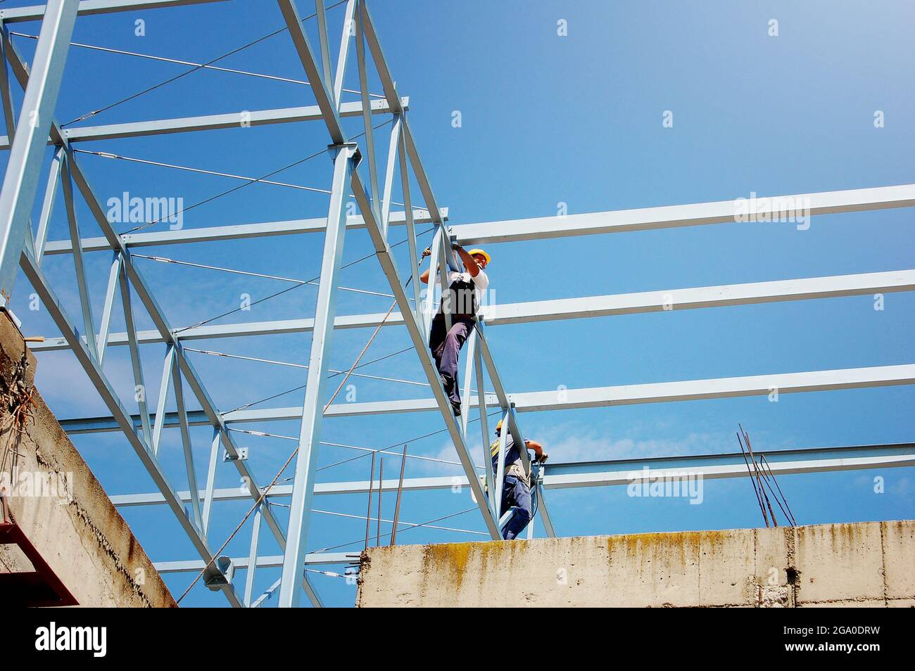 Iron Workers working on Iron Construction frame of tall apartment ...